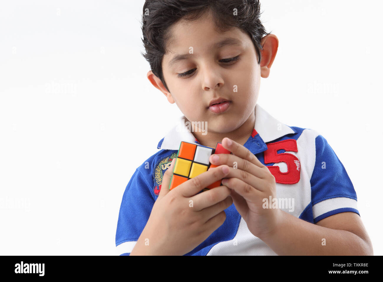 Child rubix cube hi-res stock photography and images - Alamy