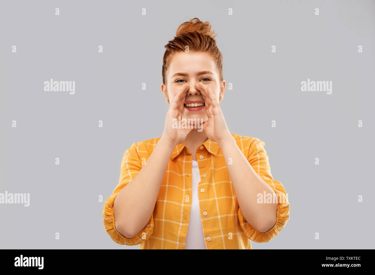 happy red haired teenage girl calling someone Stock Photo - Alamy