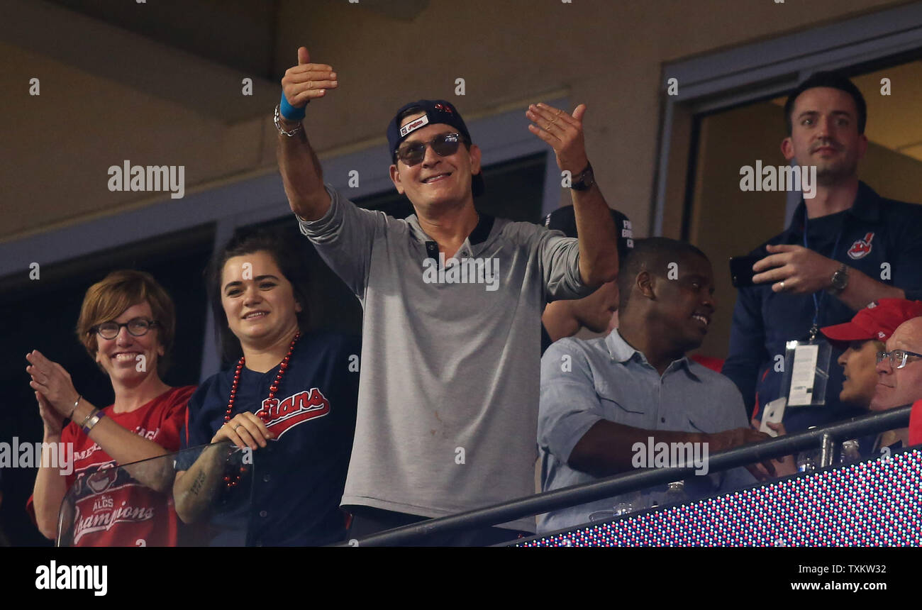 Actor and Cleveland baseball fan Charlie Sheen cheers during the sixth ...