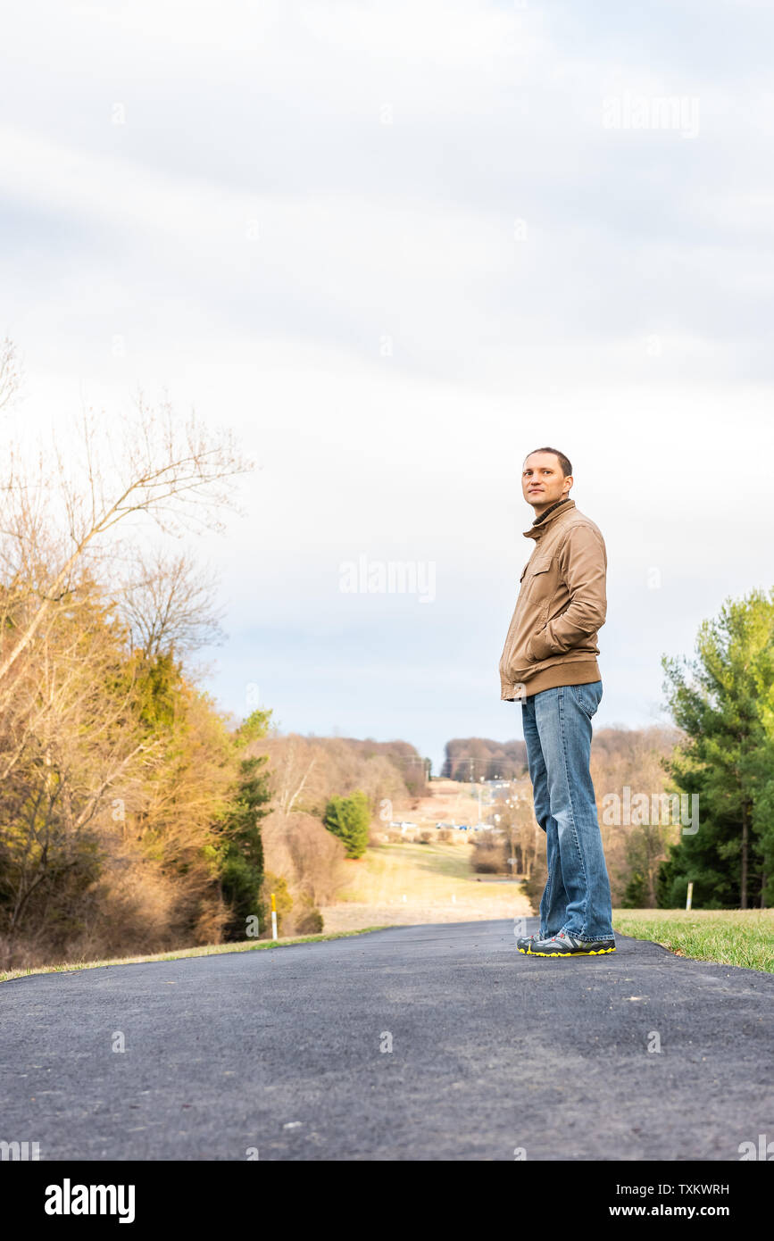 Young man standing on Sugarland Run Stream Valley Trail hike in Herndon ...