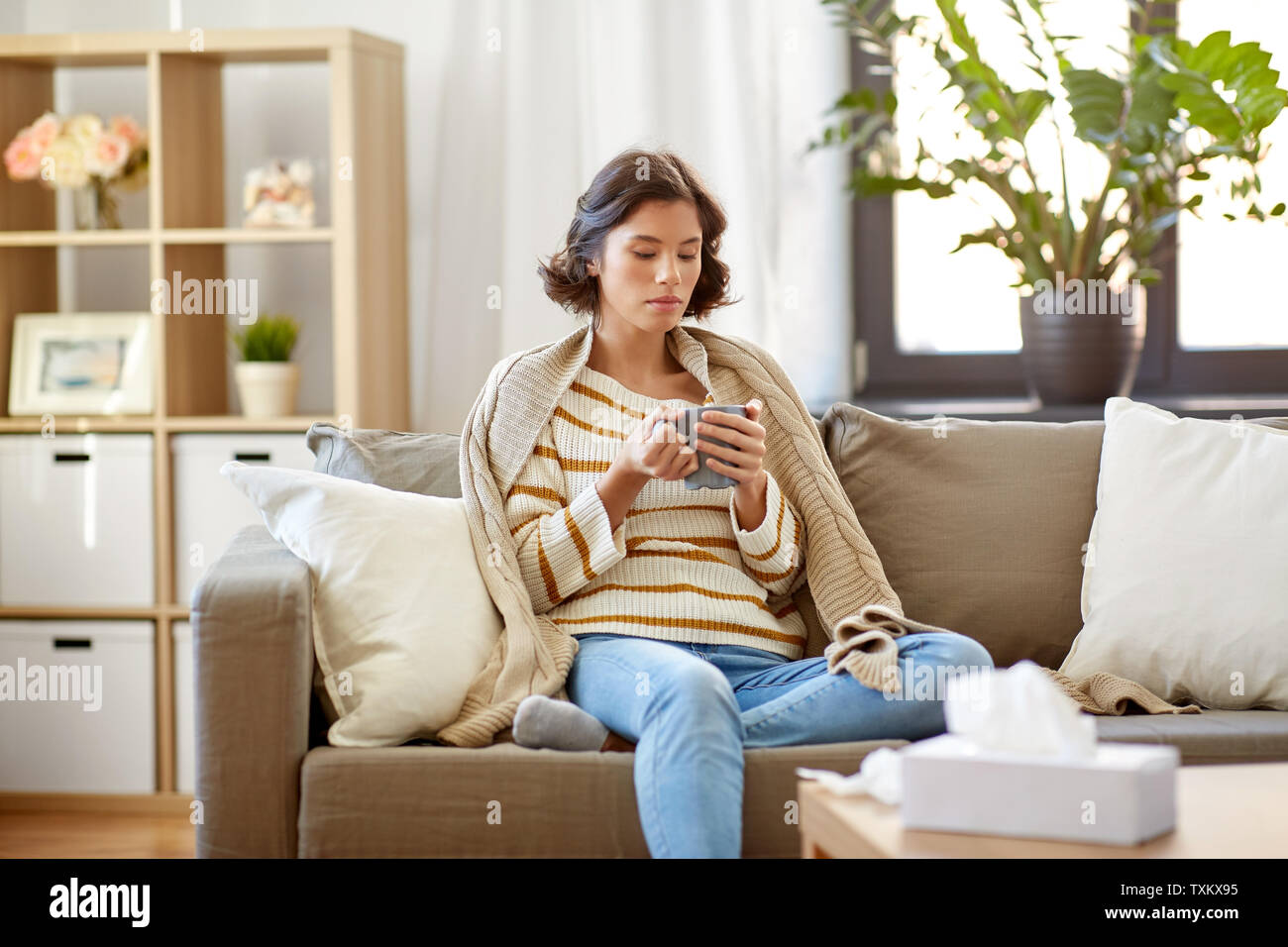 Sad sick young woman drinking hi-res stock photography and images - Alamy