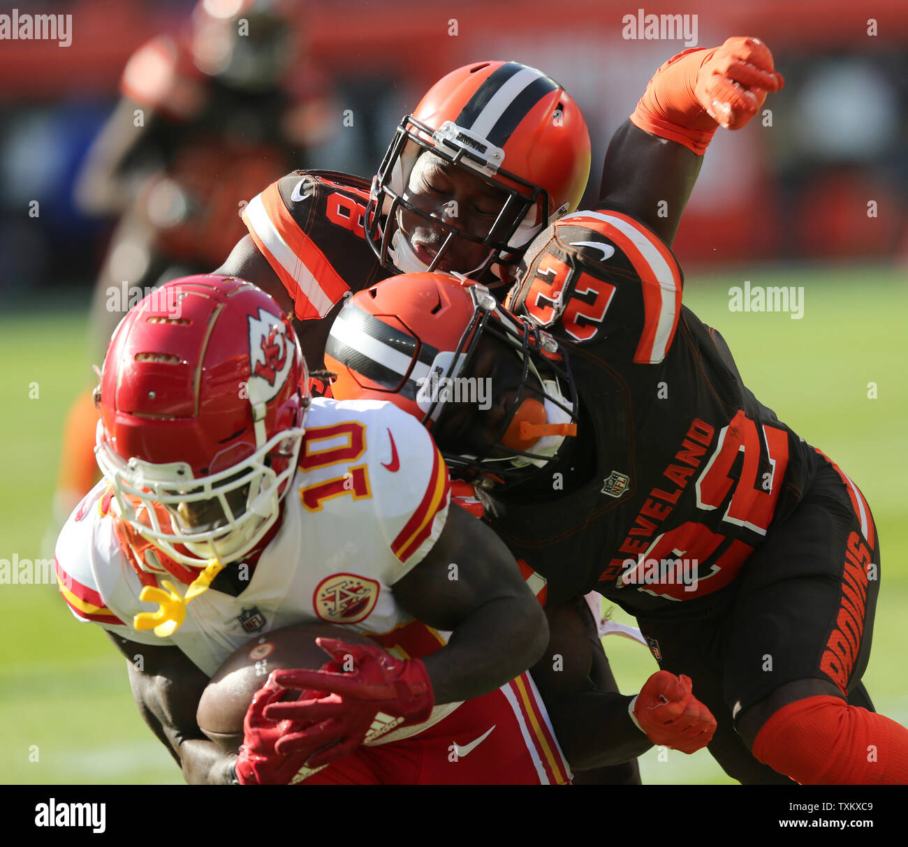 Kansas City Chief's Tyreek Hill is hit by Cleveland Brown's T.J. Carrie ...