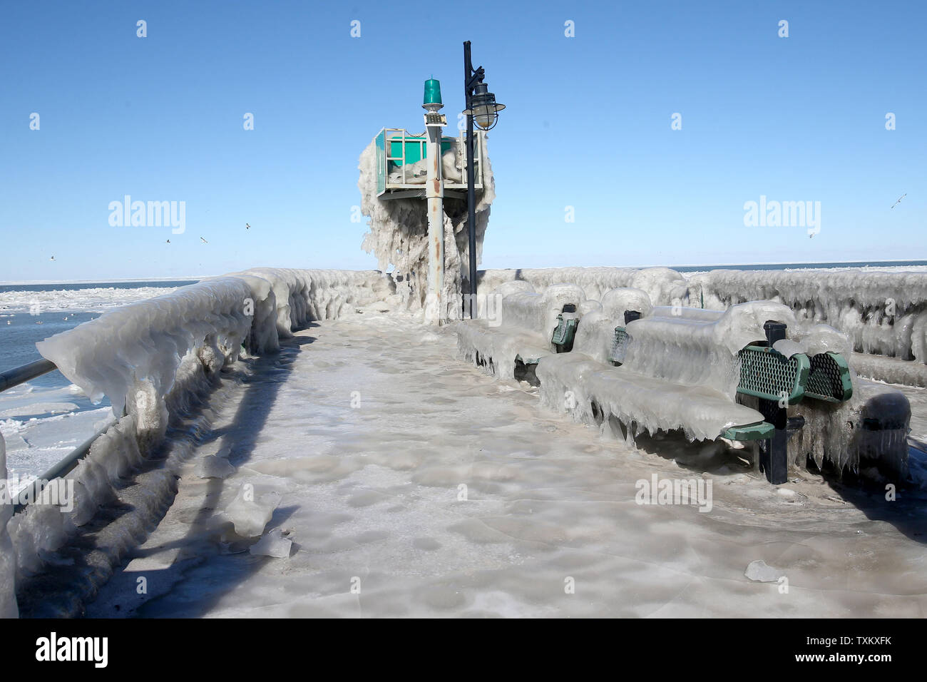 The pier Miller Road Park is covered in a thick layer of ice from the ...