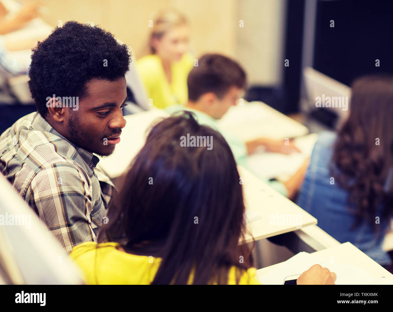 group of students talking in lecture hall Stock Photo - Alamy