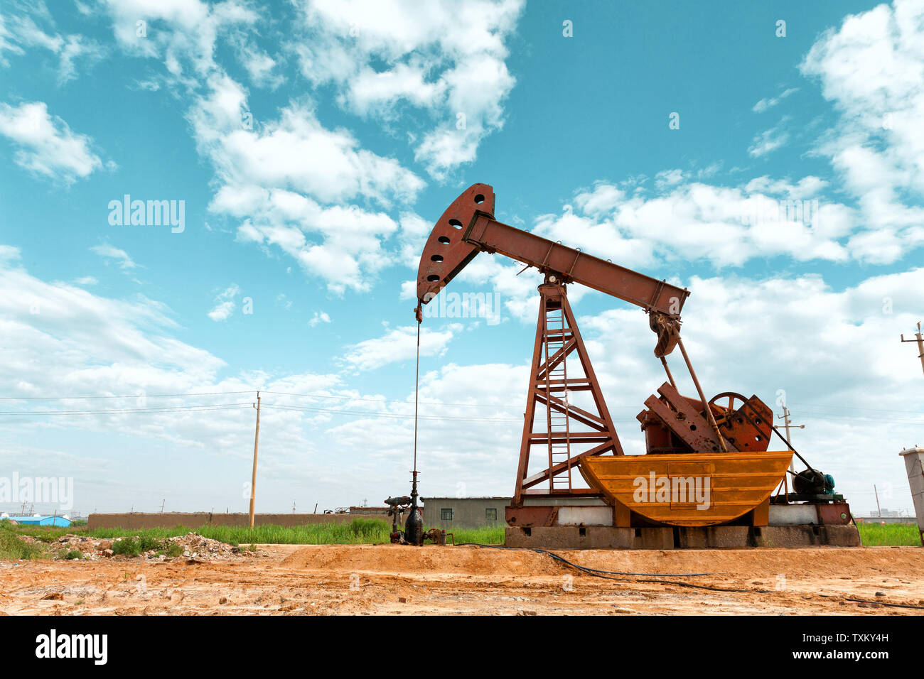 Oil well and bluesky Stock Photo - Alamy