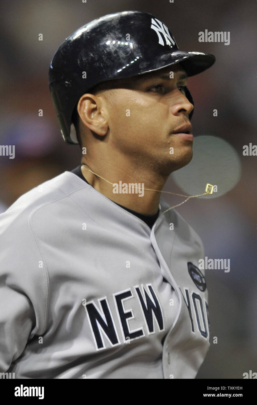 New York Yankees' Alex Rodriguez runs to first base while grouding out ...