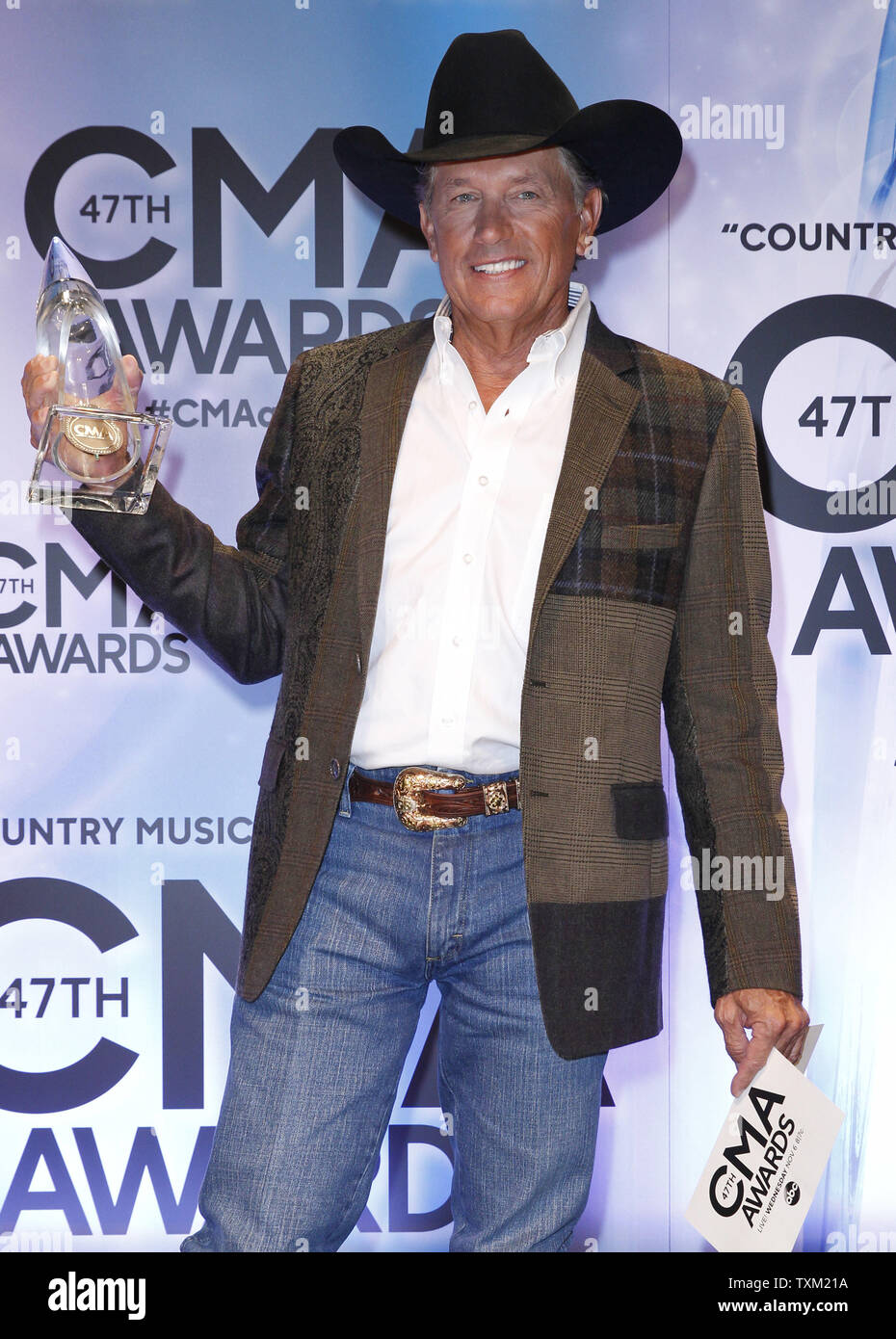 George Strait poses backstage after winning Entertainer of the Year ...