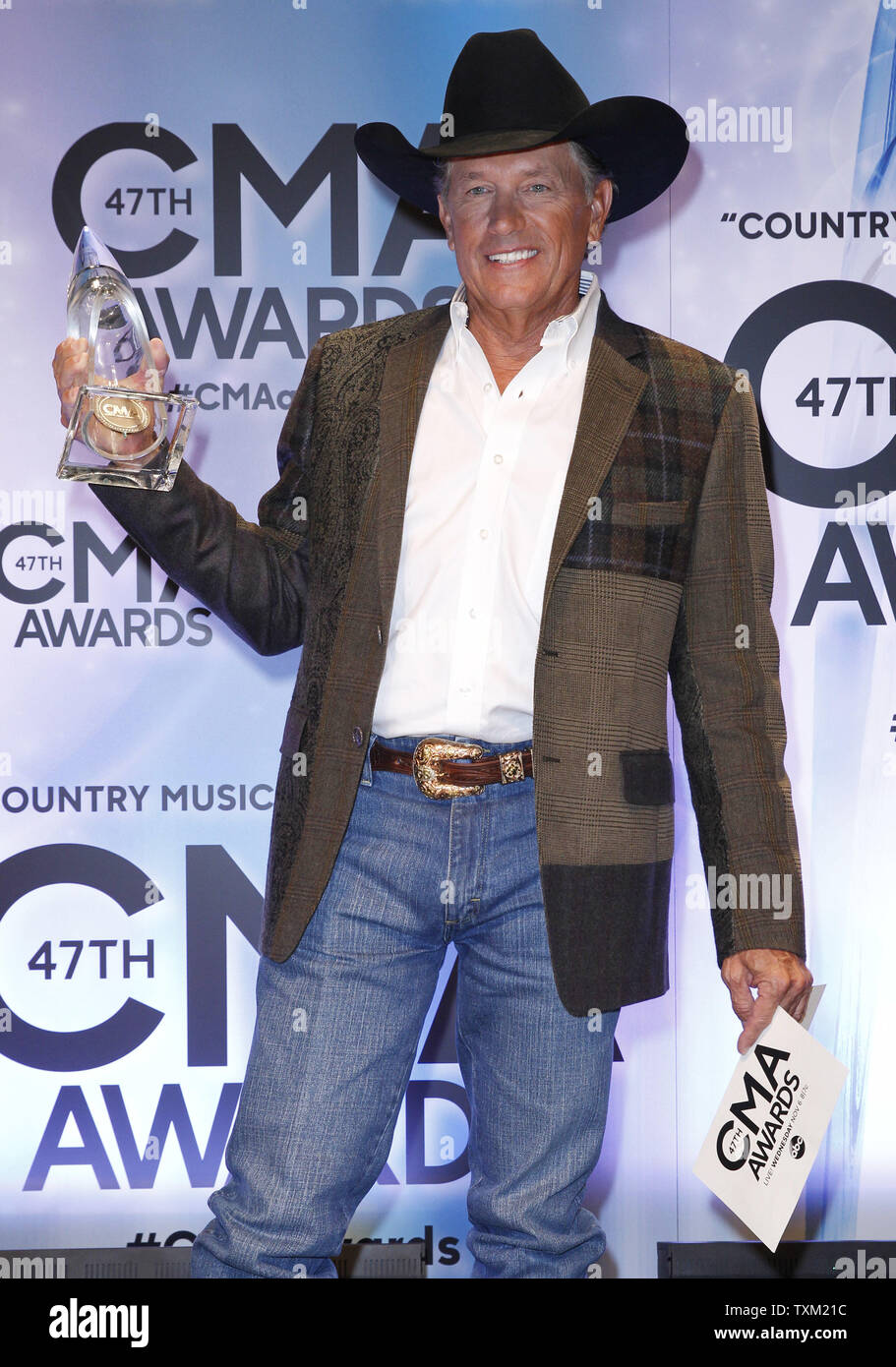 George Strait poses backstage after winning Entertainer of the Year ...