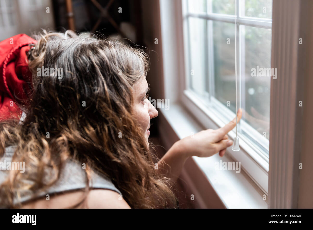 Woman outside pointing at house hi-res stock photography and images - Alamy