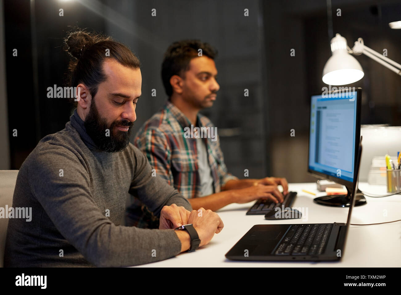 Man working late watch hi-res stock photography and images - Alamy