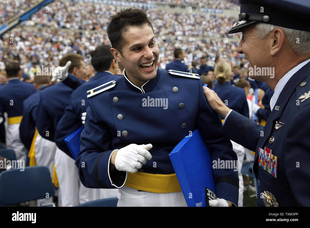Cadet Paulo Dutra of Kearny, New Jersey shares a laugh with Col. Paul ...