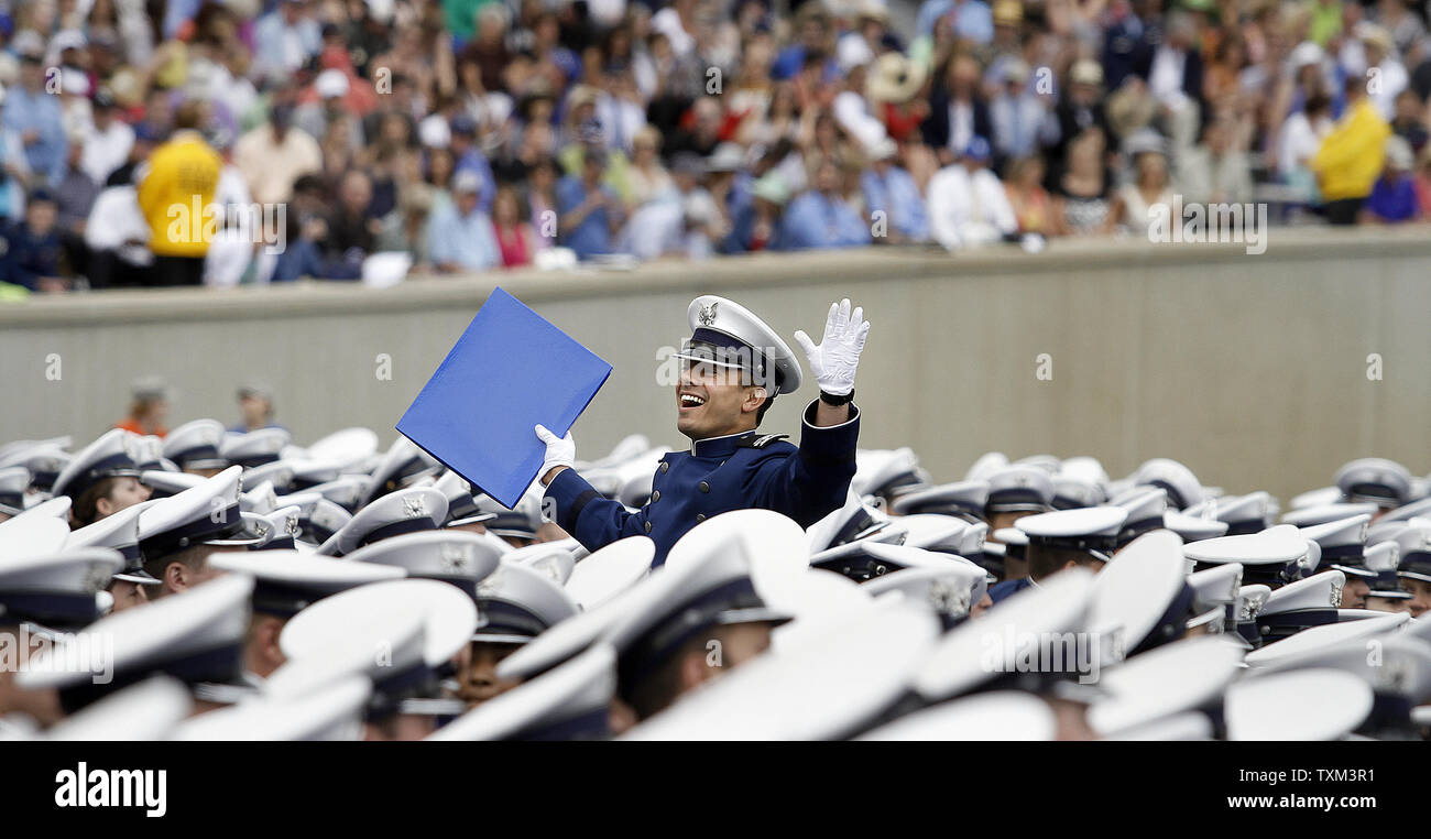 An Air Force Academy cadet celebrates after receiveing his diploma at ...