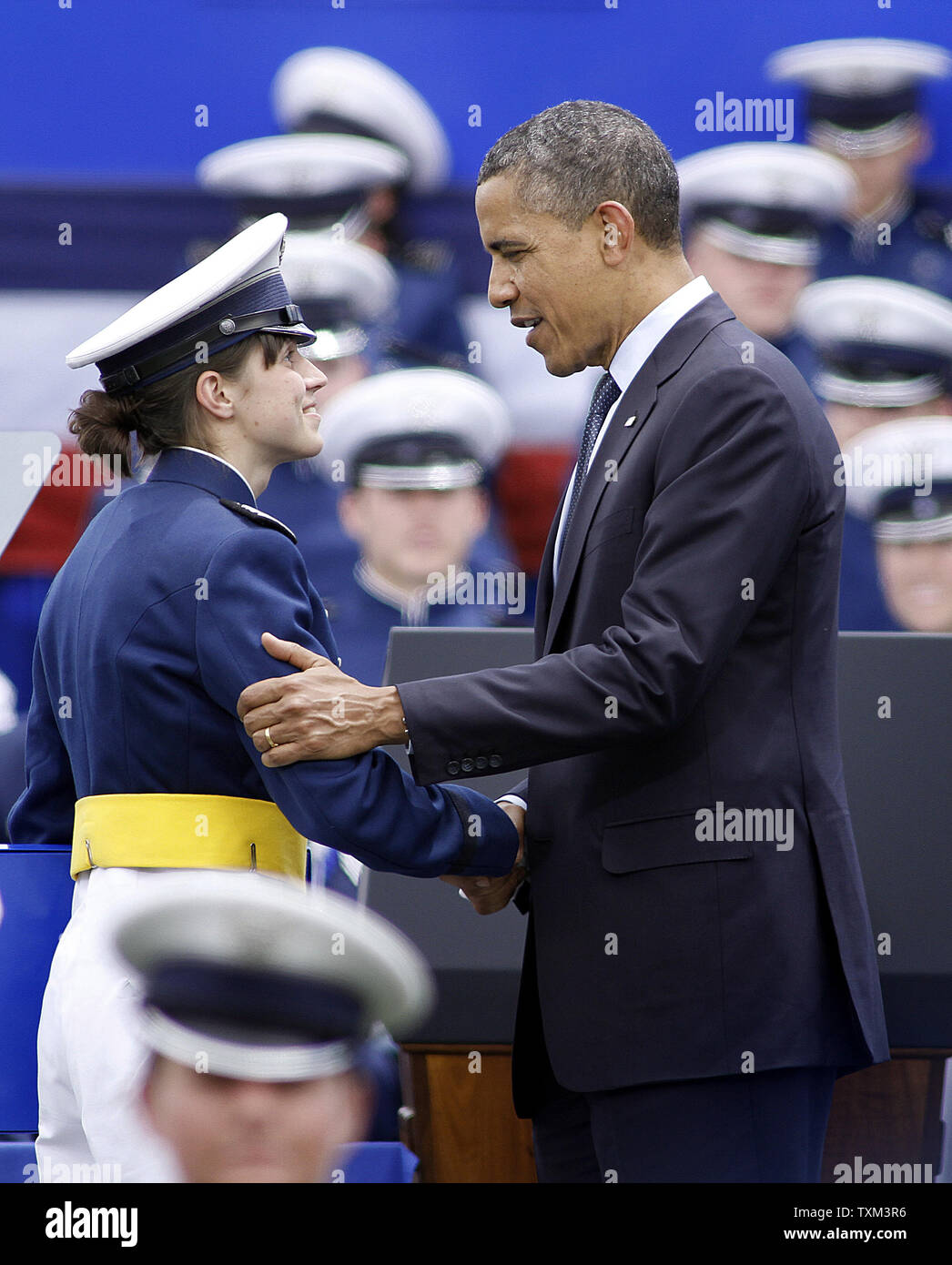 President Barack Obama shakes hands and congratulates a female Air ...