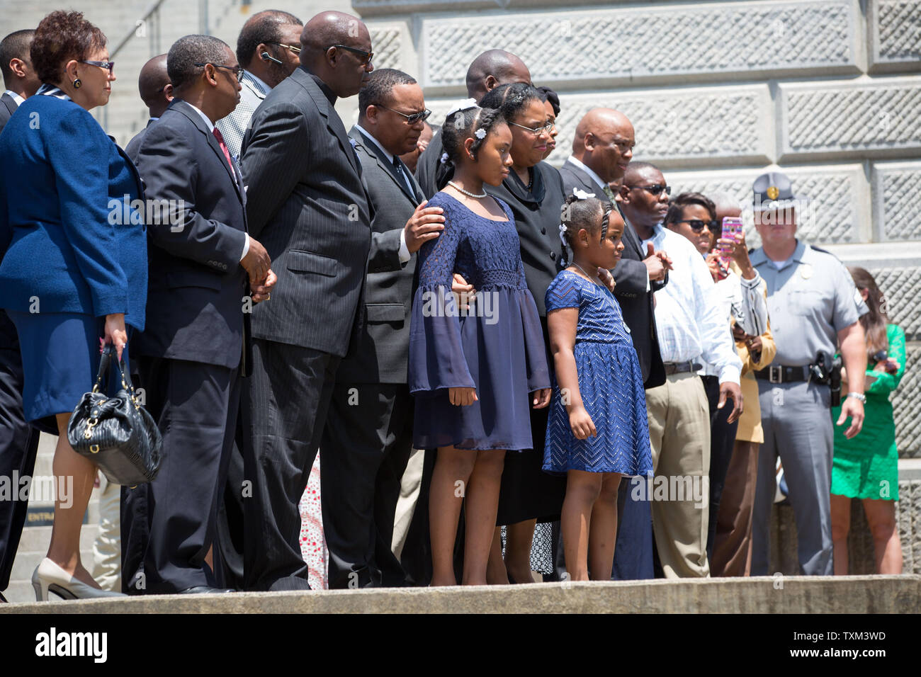 The family of Sen. Clementa Pinckney watch as his casket is carried by ...
