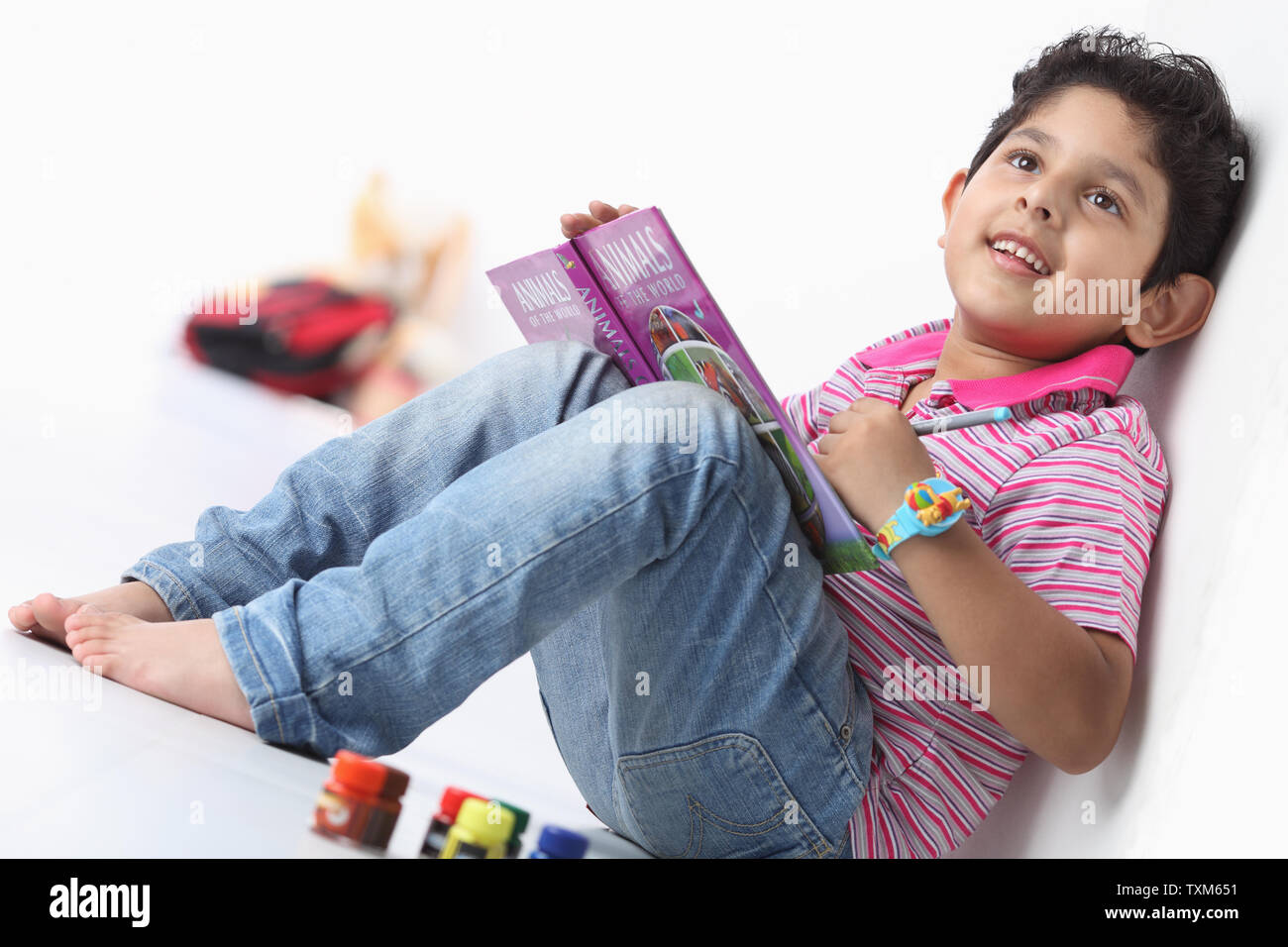 Boy coloring on a book Stock Photo - Alamy