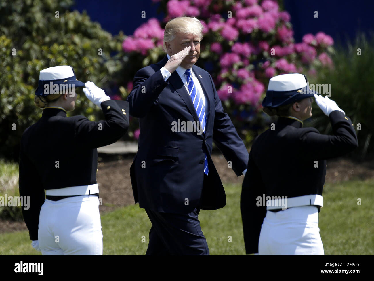 United States President Donald J. Trump salutes as he arrives to give a ...