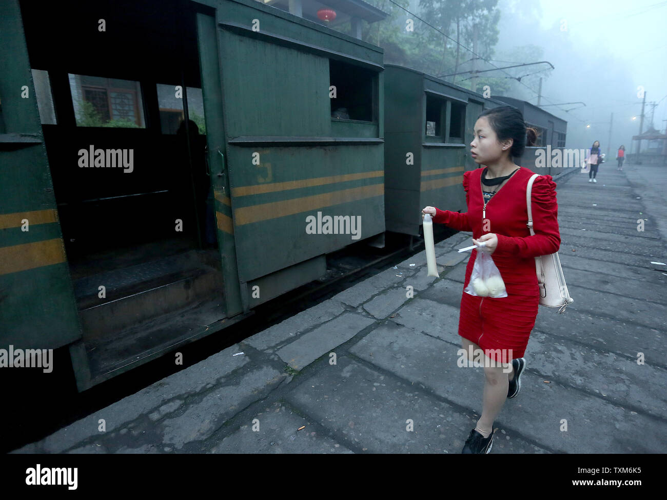 A Chinese woman decides what steam train carriage to travel in before ...