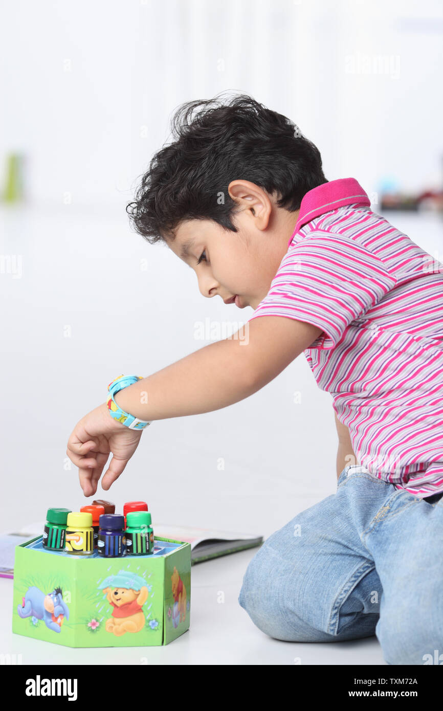 Child picking at paint hi-res stock photography and images - Alamy
