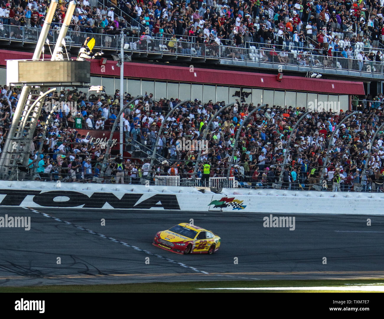 Joey Logano corsses the finish line winning the 57th Daytona 500 at ...