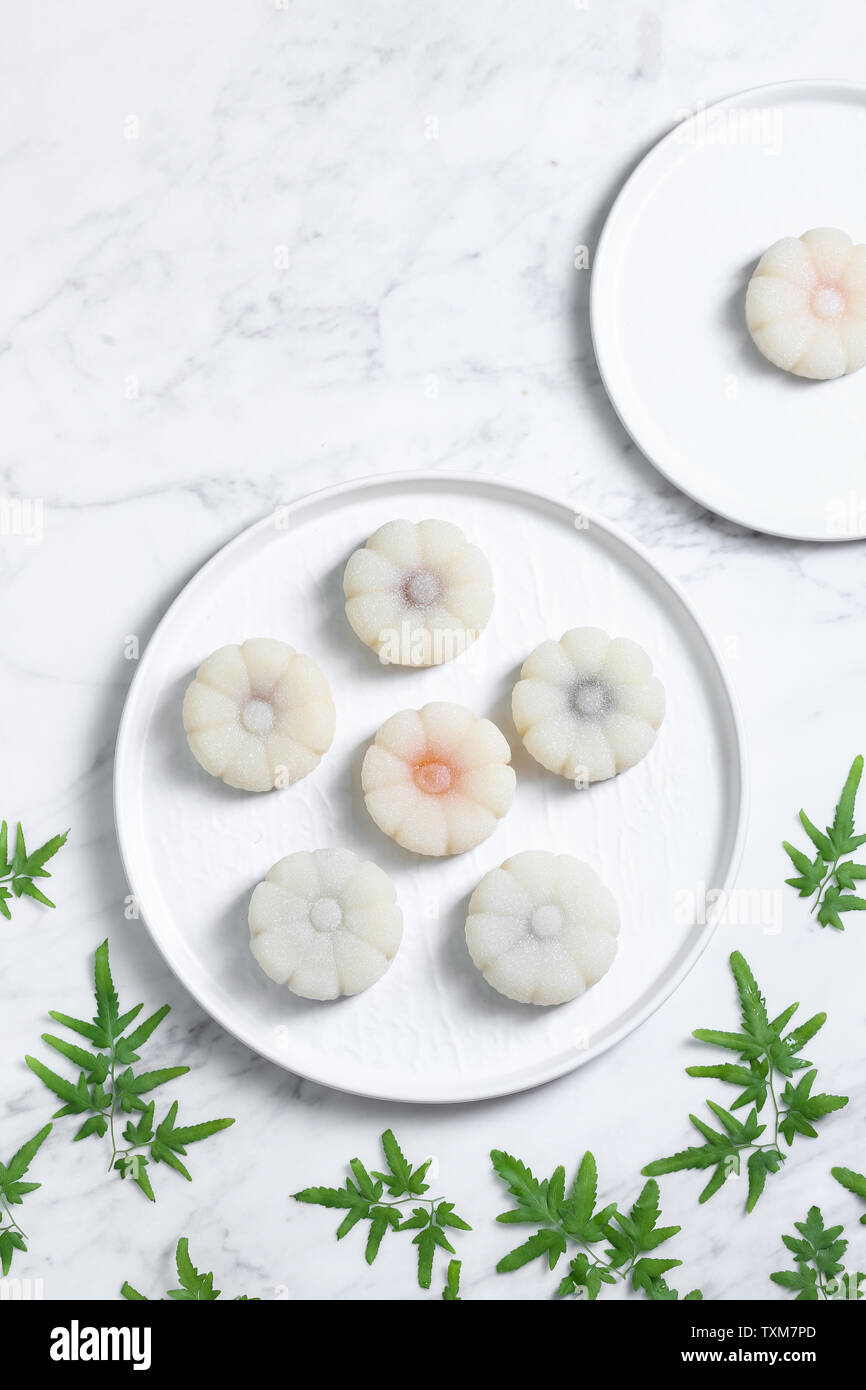 Fruit ice skins moon cakes on white marble background Stock Photo - Alamy
