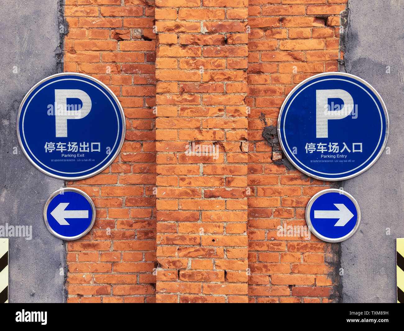 Directional sign for car park entrances and exits on the wall Stock ...