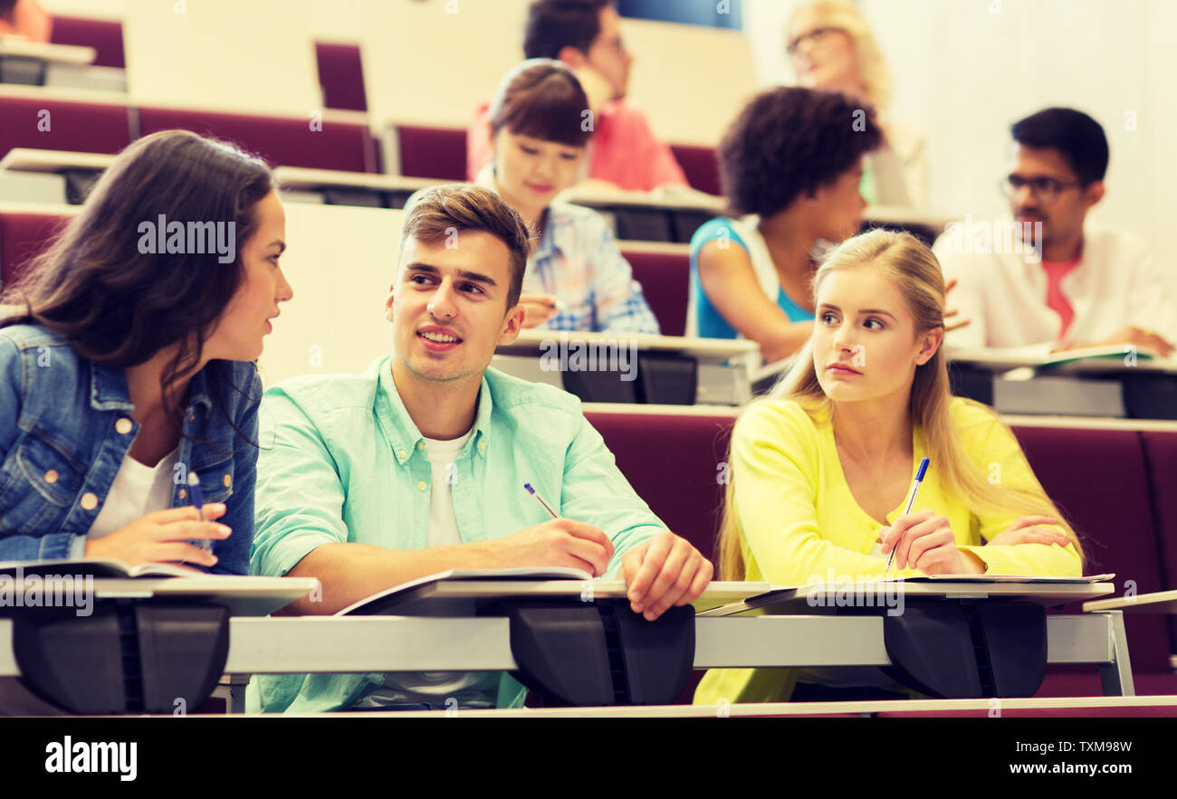 group of students with notebooks in lecture hall Stock Photo - Alamy