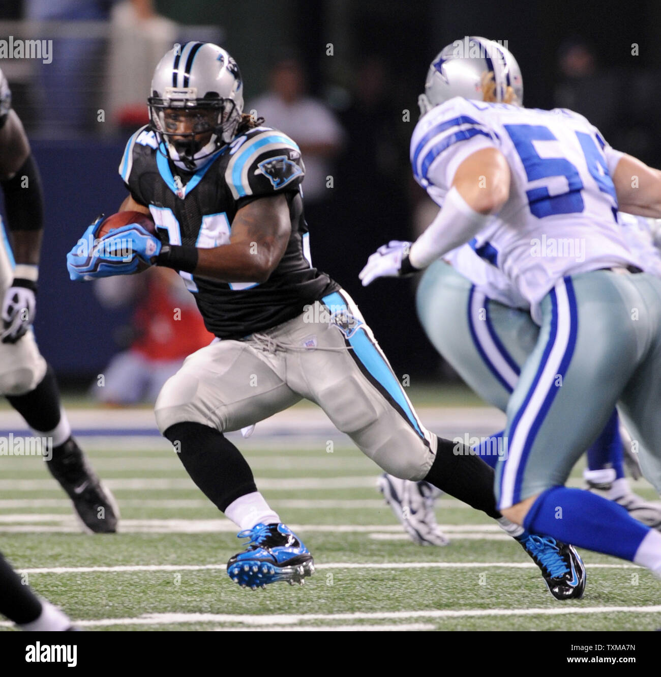 The Carolina Panthers DeAngelo Williams rushes against the Dallas ...