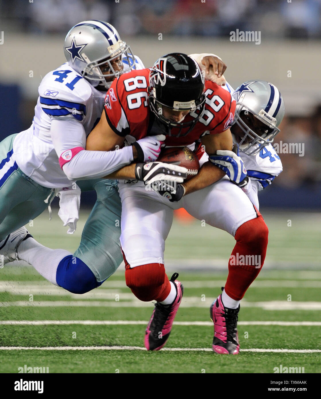 Dallas Cowboys Terence Newman (41) and Gerald Sensabaugh wap up Atlanta ...