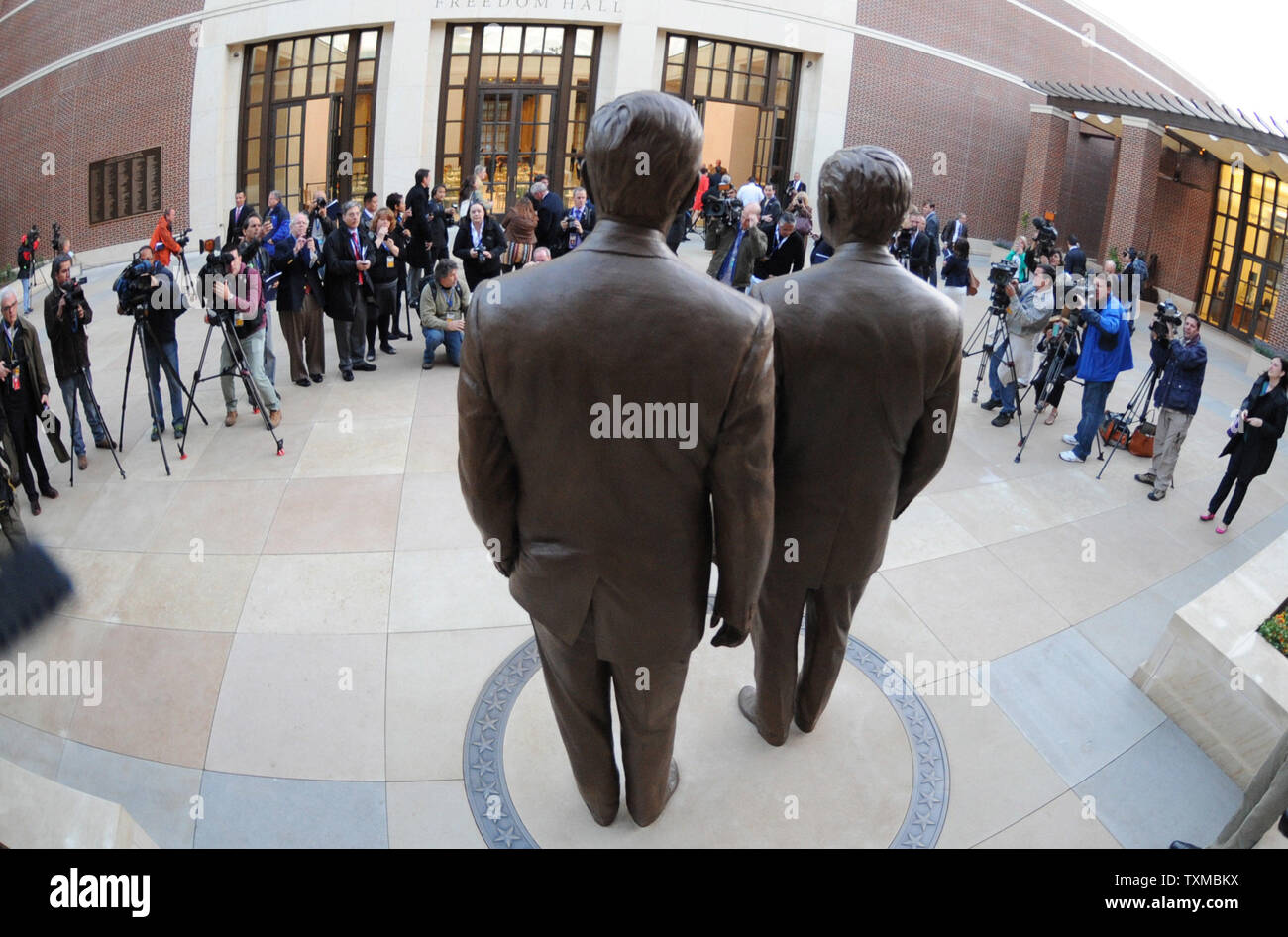 Statues of Presidents George W. and George H.W. Bush are seen during a ...