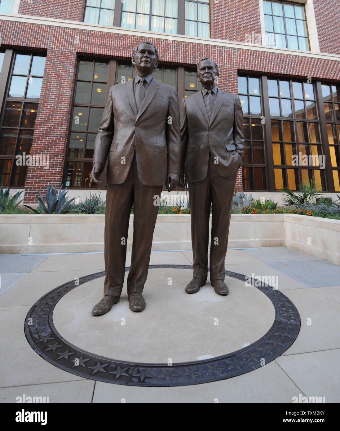Statues of Presidents George W. and George H.W. Bush are seen during a ...