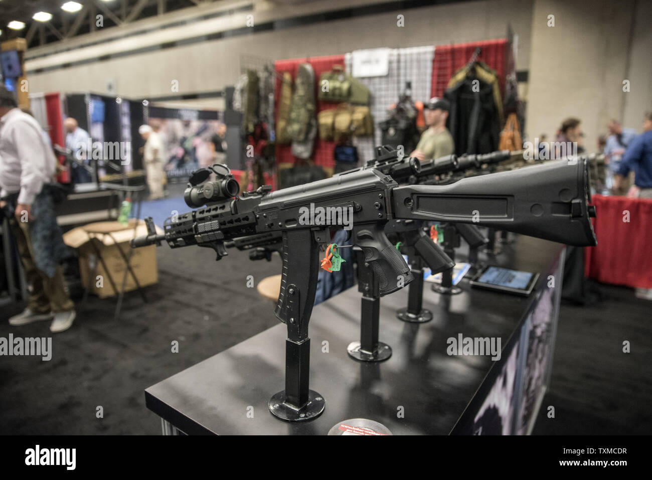 A gun sits on display at a booth on the floor of the exhibition hall at ...