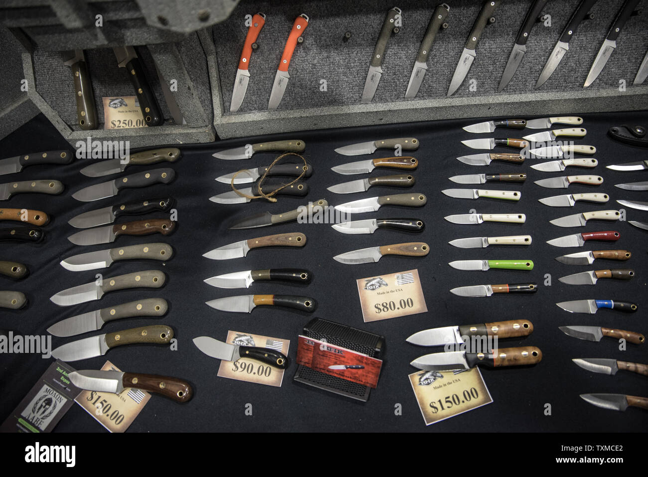 A display of knives at a booth on the floor of the exhibition hall at ...