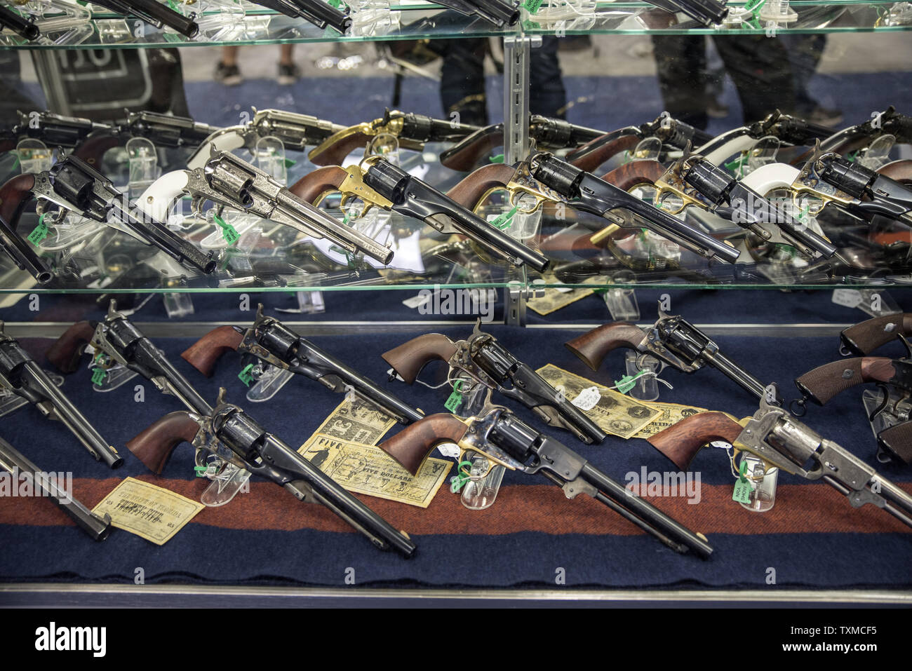 A display of revolvers is seen inside the exhibition hall at the 147th ...