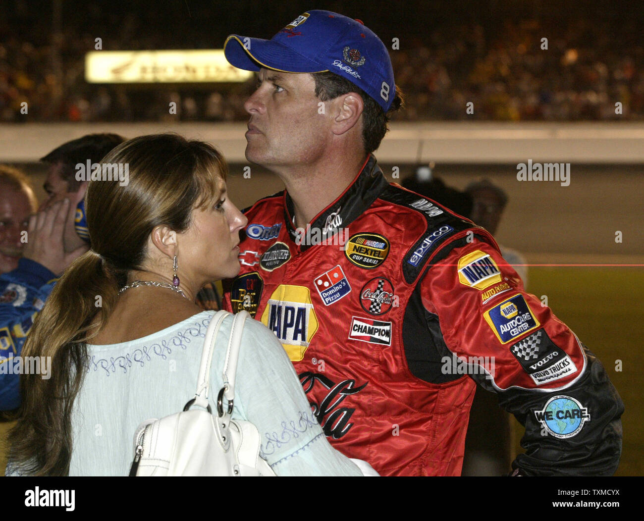Michael Waltrip and his wife wait for the rained delayed start of the ...
