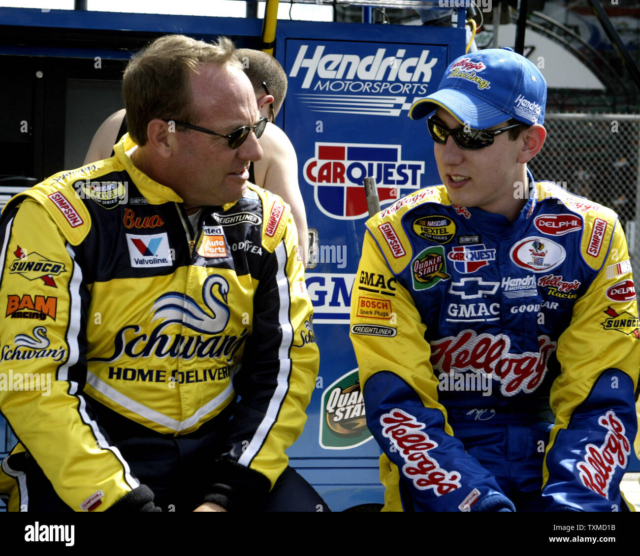 Ken Schrader(L) talks with fellow driver Kyle Busch, prior to the start ...