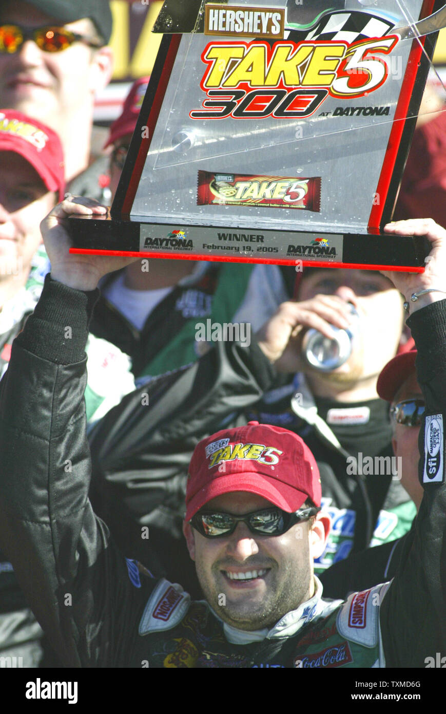 Tony Stewart celebrates winning the NASCAR Hershey's Take 5 300 , at ...