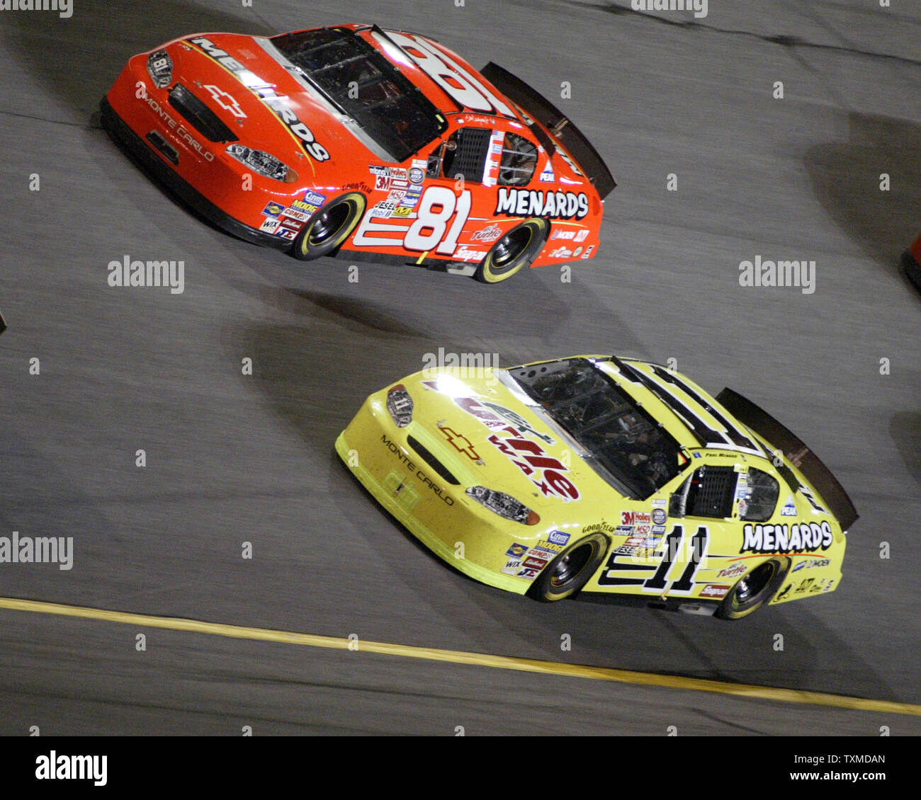 Teammates Dale Earnhardt Jr (81) and Paul Menard run through turn four ...