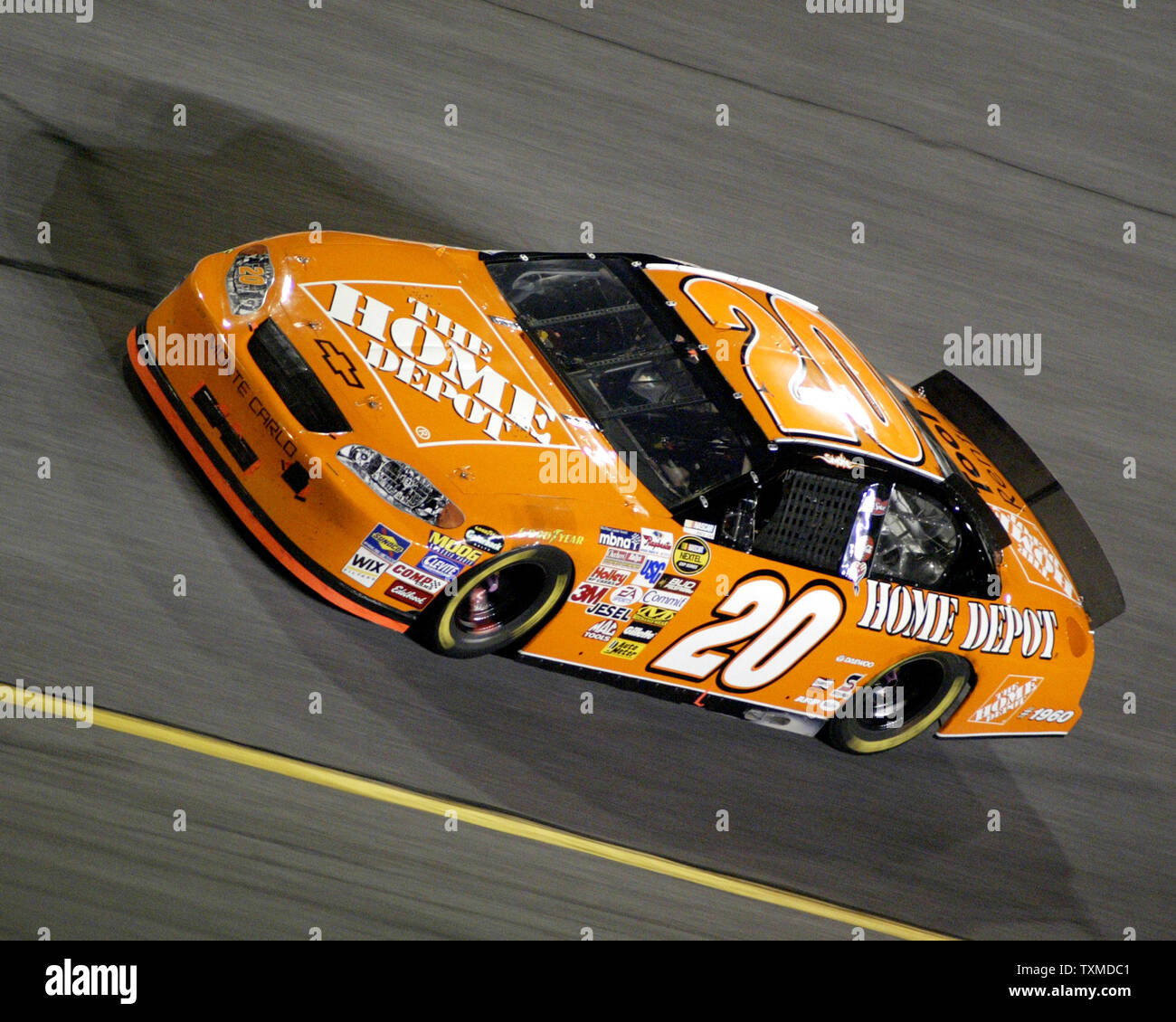 Tony Stewart runs through turn four en-route to winning the NASCAR ...
