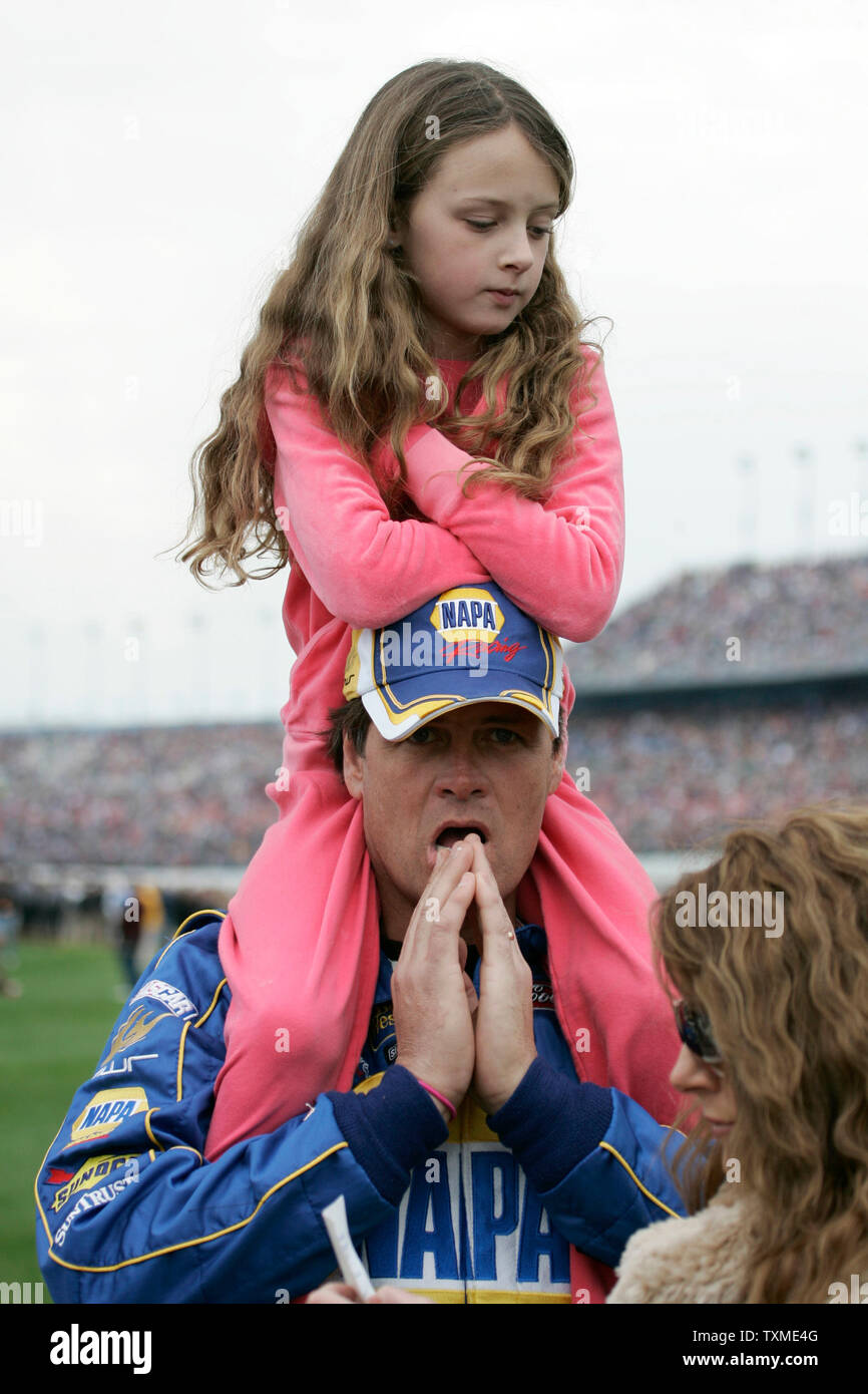 Michael Waltrip has a quiet moment with his daughter and wife on pit ...