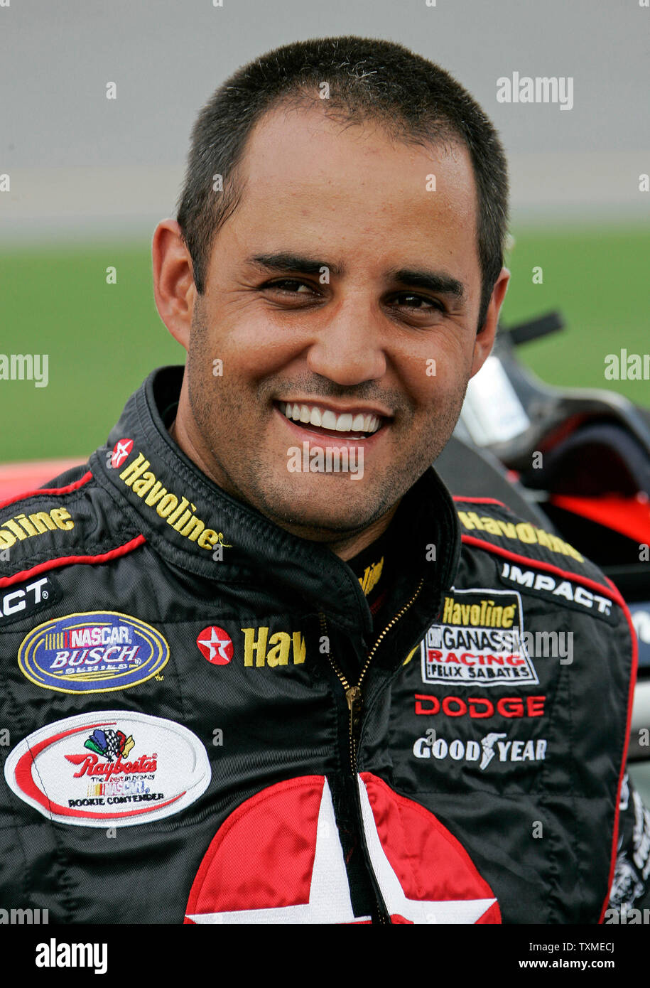 Juan Pablo Montoya waits on pit row prior to qualifying for NASCAR ...