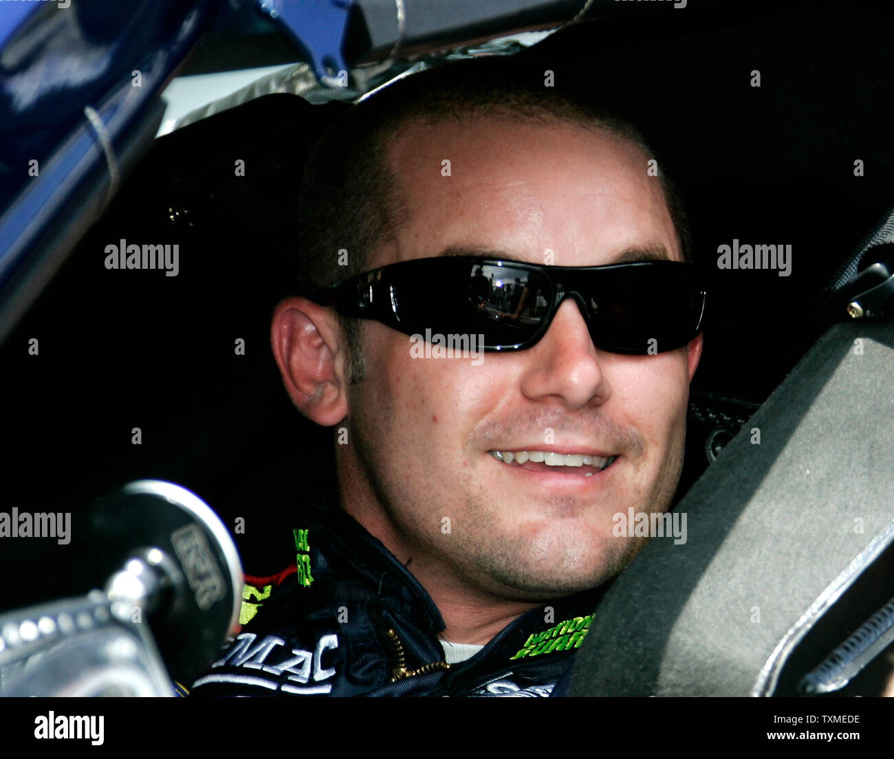 Casey Mears waits in his car on pit row prior to qualifying for NASCAR ...
