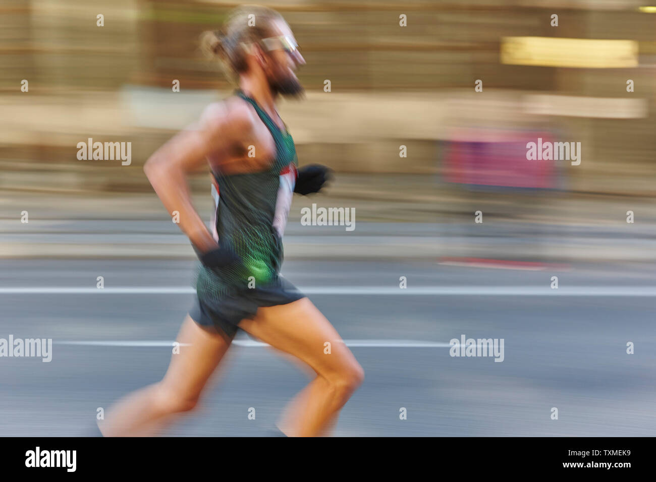 Marathon runner in motion on the street. Healthy lifestyle. Exercise ...
