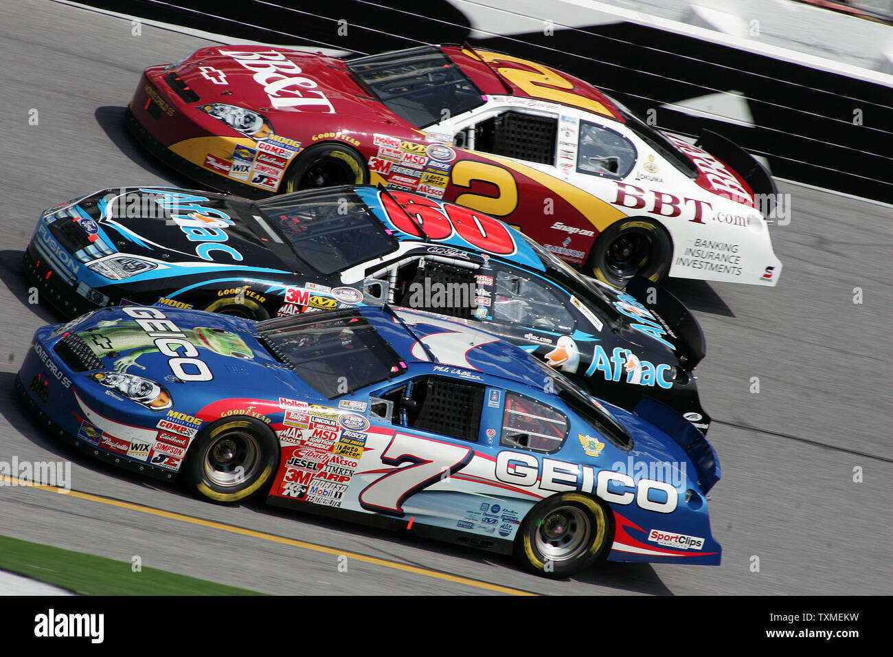 Clint Bowyer (2), Carl Edwards (60) and Mike Wallace (7) go three wide ... Clint Bowyer (2), Carl Edwards (60) and Mike Wallace (7) go three wide ...