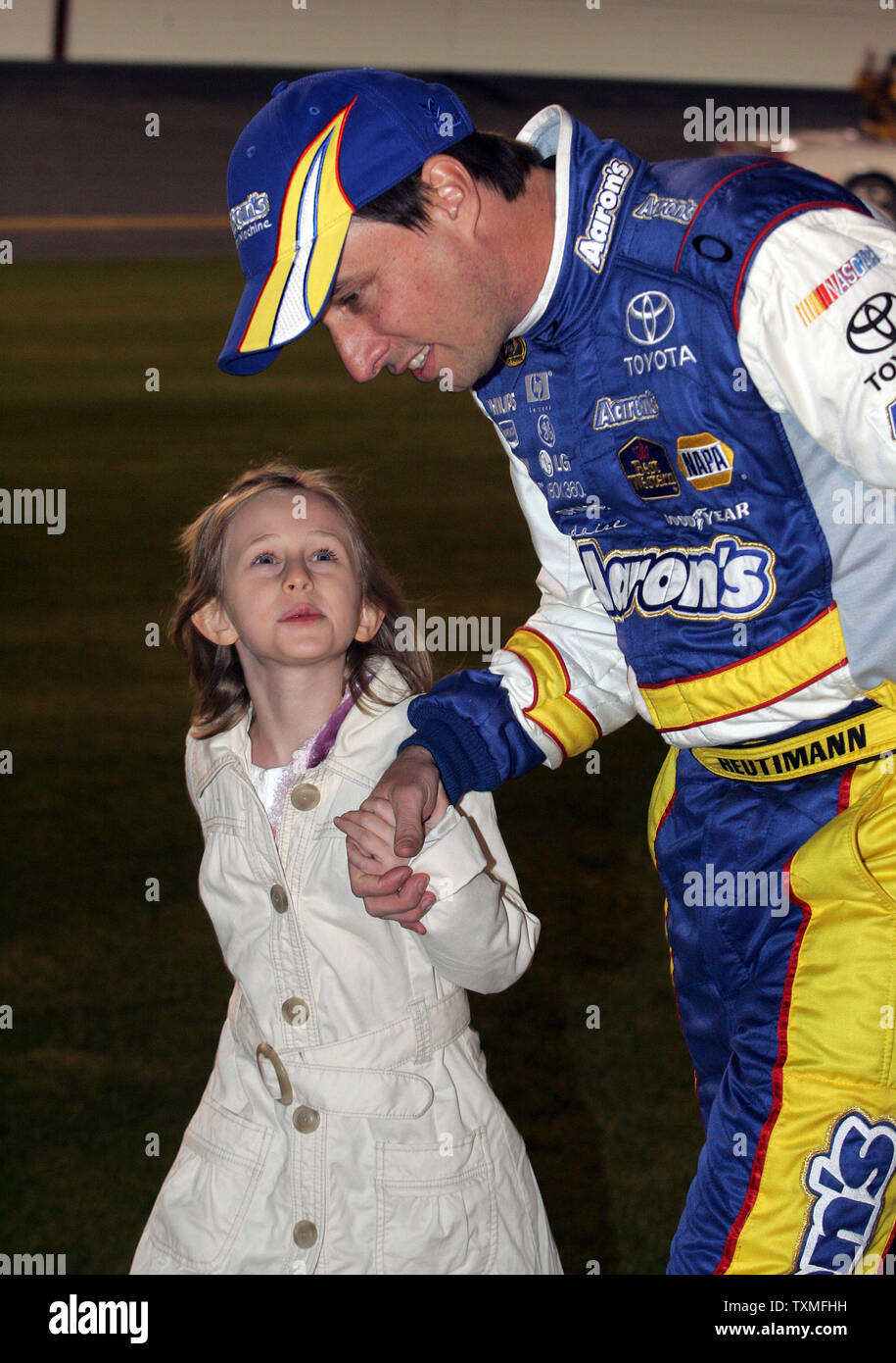 NASCAR Sprint Cup driver David Reutimann and his daughter walk down pit ...