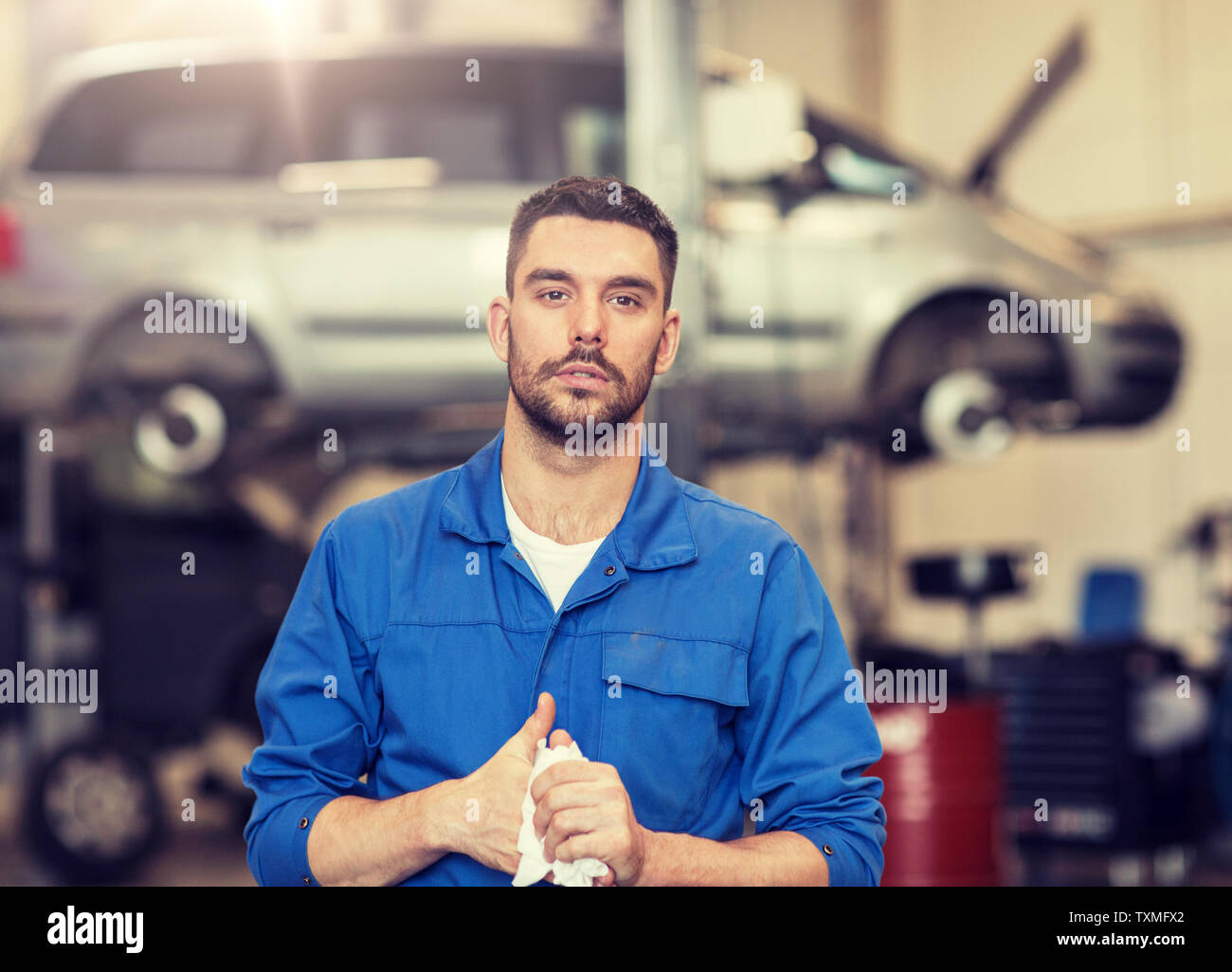 auto mechanic man or smith at car workshop Stock Photo - Alamy