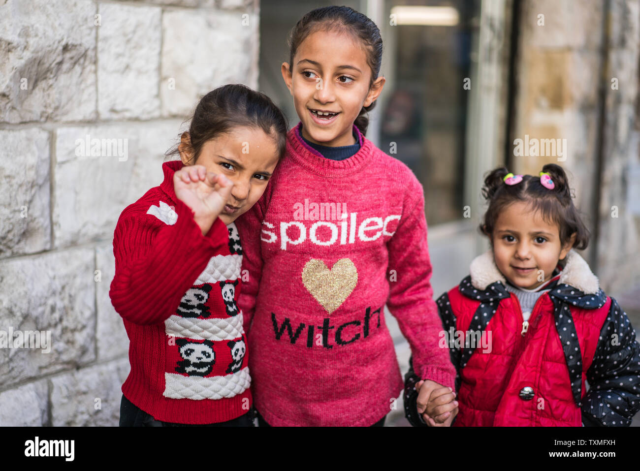 Three girls in the street of the Amman, Jordan Stock Photo - Alamy