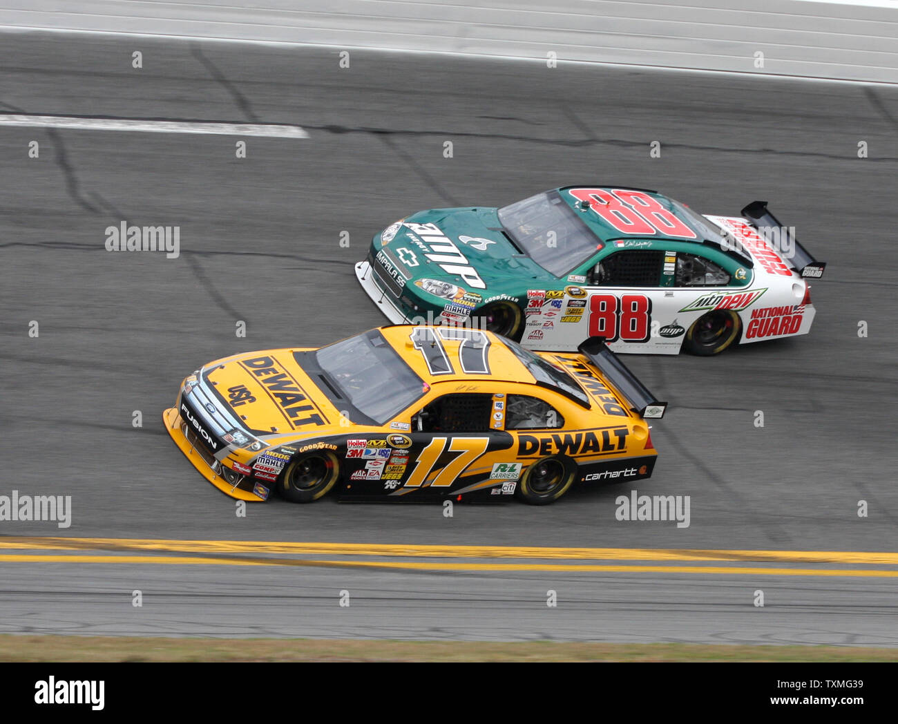 Matt Kenseth (17) passes dale Earnhardt Jr (88) in turn four en route ...