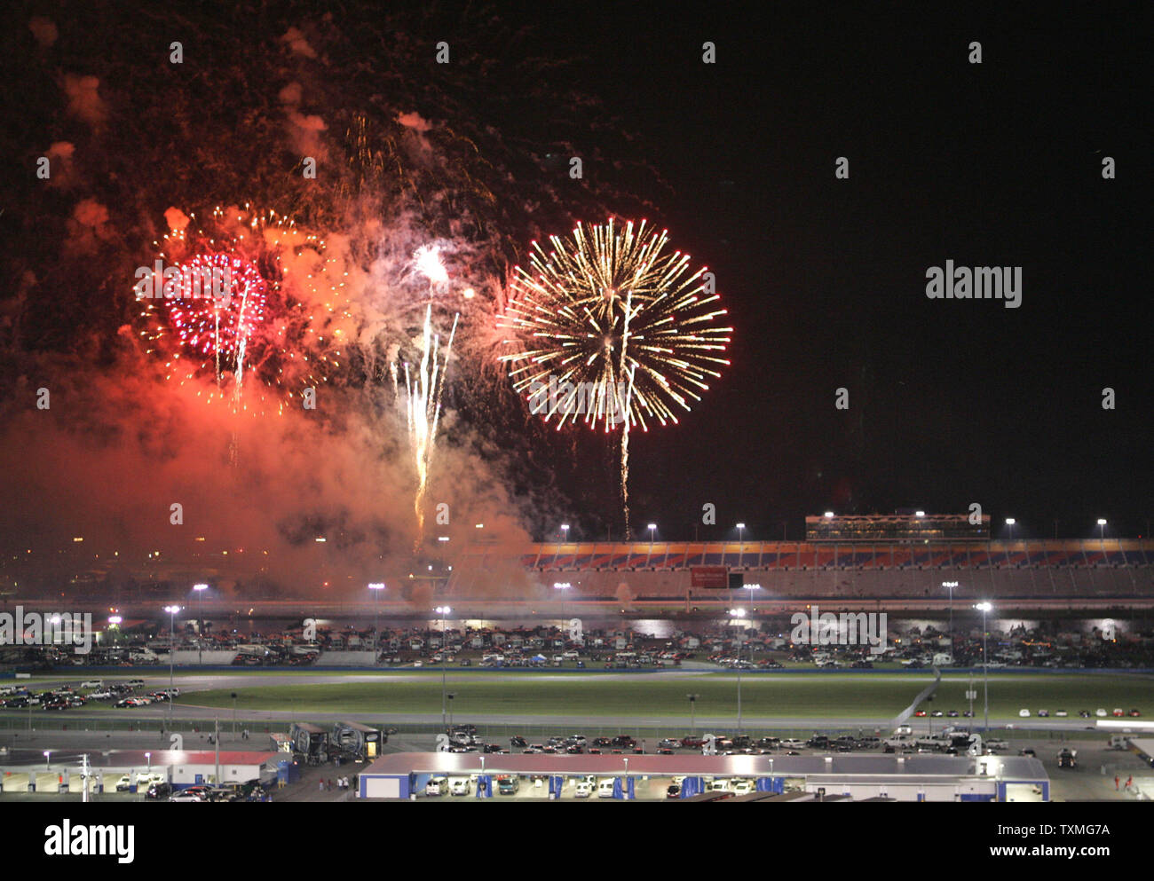 Fireworks light up the sky at the conclusion of the NASCAR Coke Zero ...