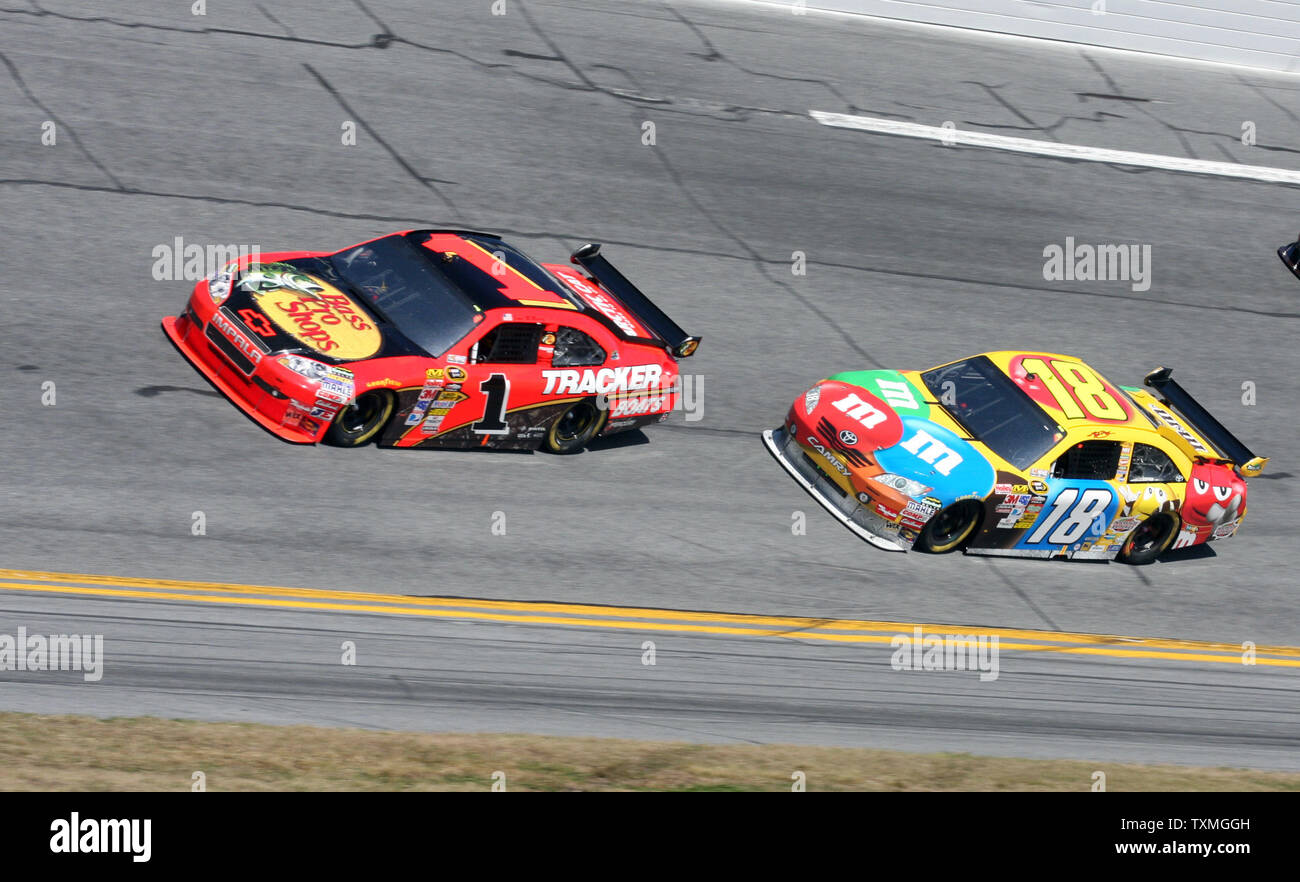 Jamie McMurray (1) passes Kyle Busch (18) en-route to winning the ...