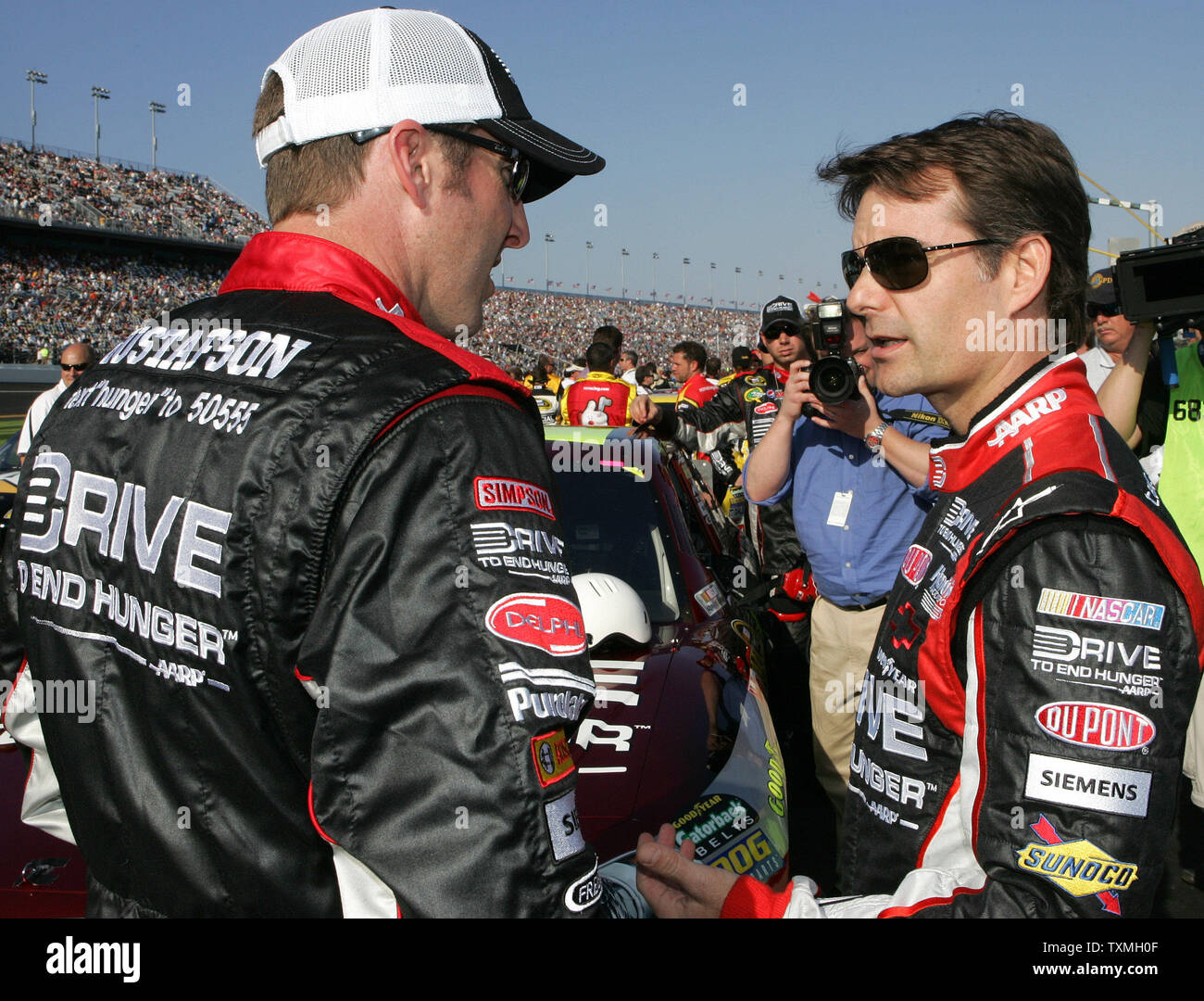 Jeff Gordon (R) talks to his crew chief Andy Gustafson prior to the ...